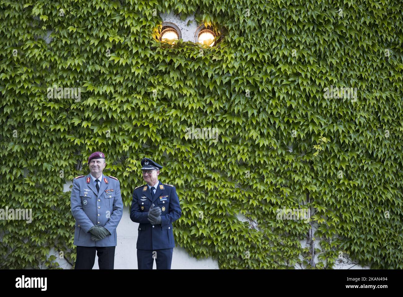 Two officers are pictured before the meeting between German Chancellor ...