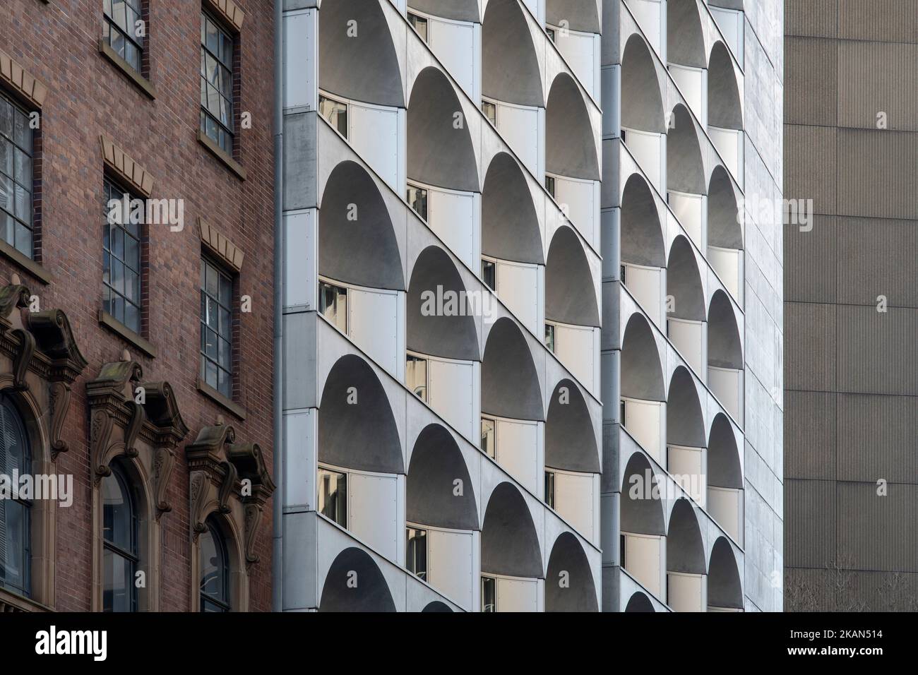 Detail of arched windows sandwiched between neighbouring buildings. The ...