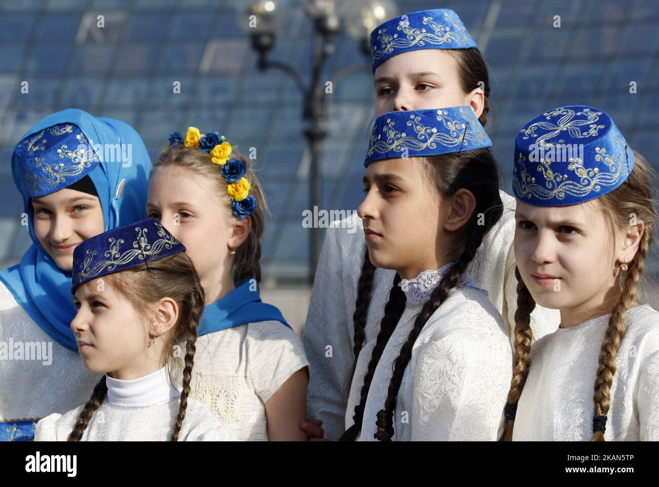 Children wearing Crimean Tatar national costumes attend a commemoration rally to mark the ...