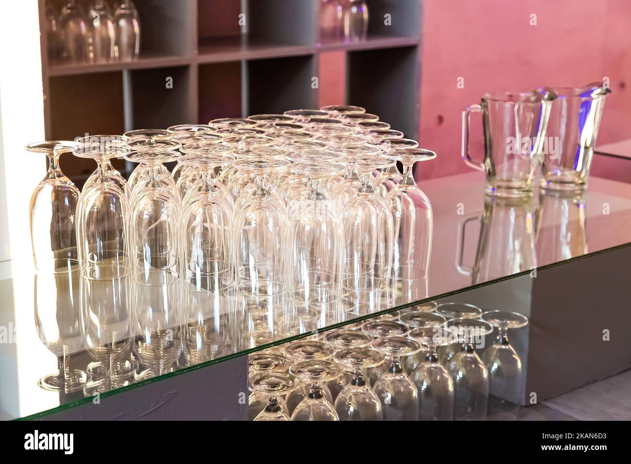 A closeup shot of upside down glasses on a bar counter Stock Photo - Alamy