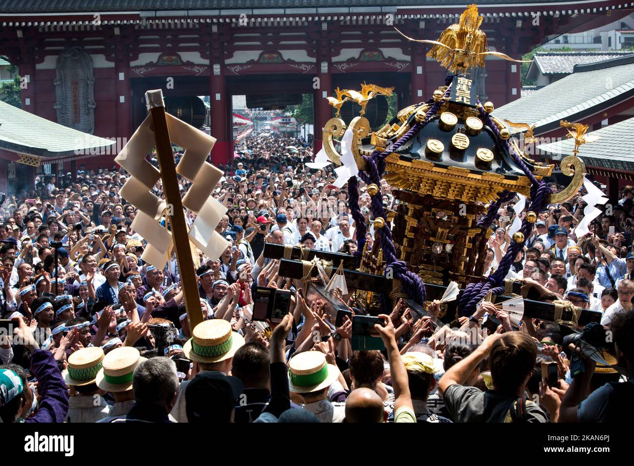 The residents of Asakusa band together to carry a 'mikoshi' (portable ...