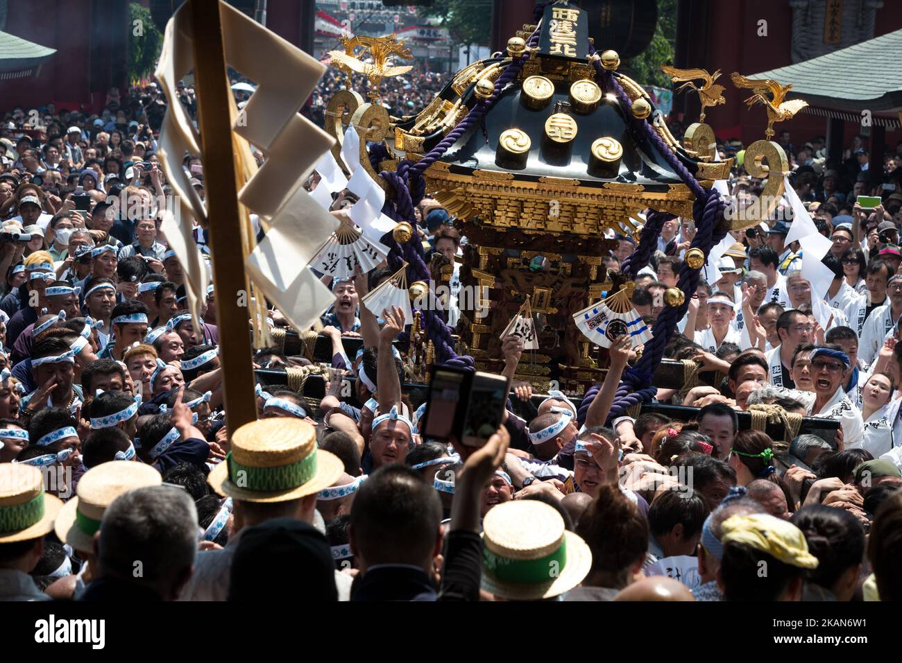The residents of Asakusa band together to carry a 'mikoshi' (portable ...