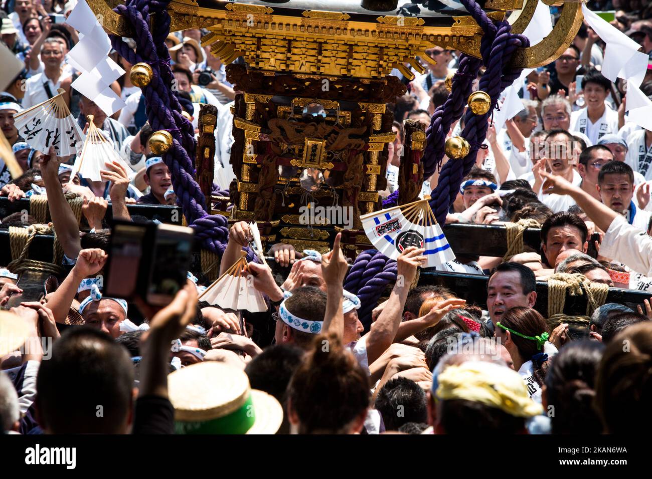 The residents of Asakusa band together to carry a 'mikoshi' (portable ...