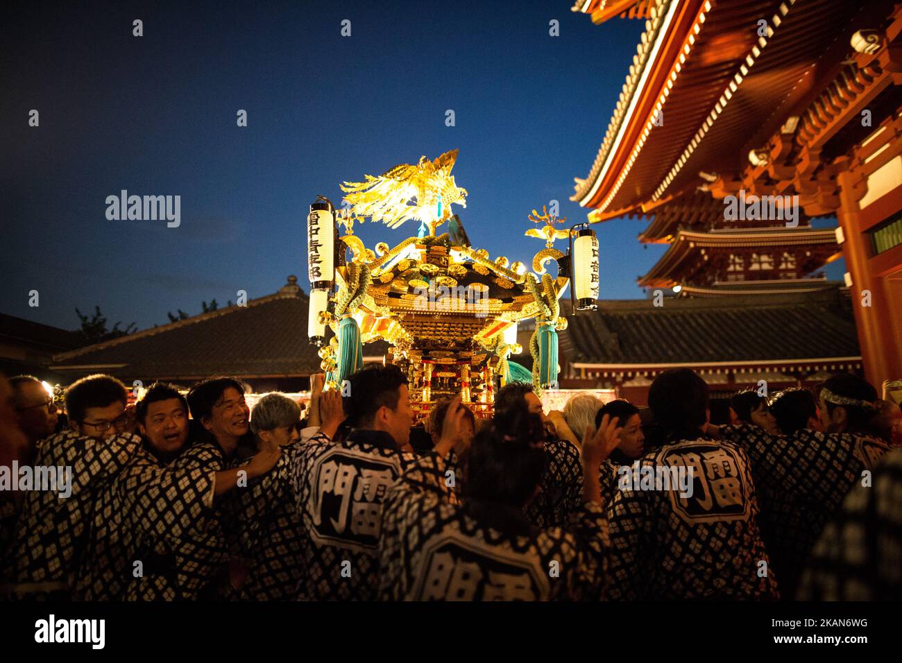 The residents of Asakusa band together to carry a 'mikoshi' (portable ...