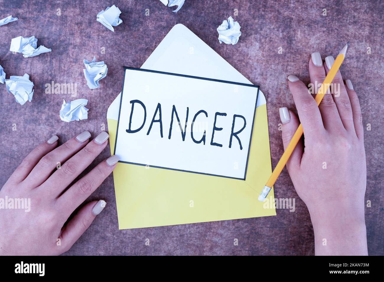 Hand writing sign Danger. Word Written on general word for liability to ...
