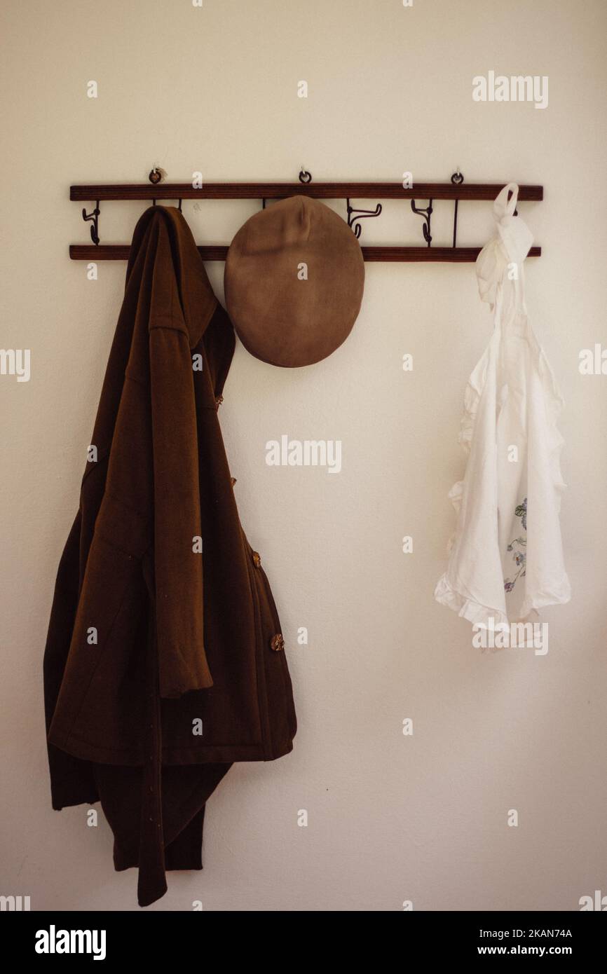 A vertical shot of a male suit and jacket hung on the hangers Stock ...