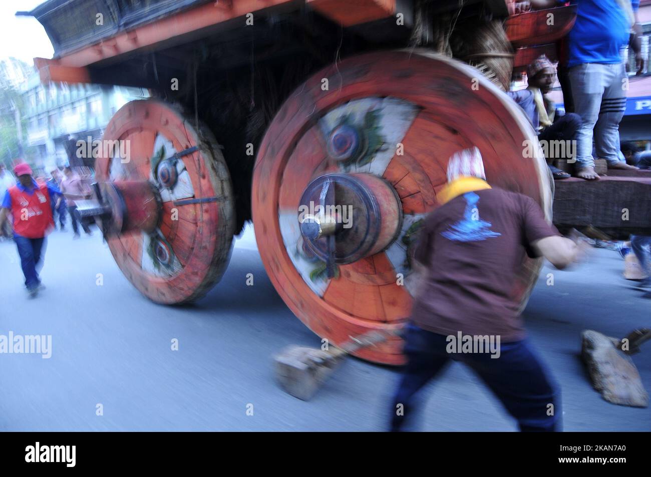 Nepalese Devotees arranging wheel of the chariot during the last day of ...