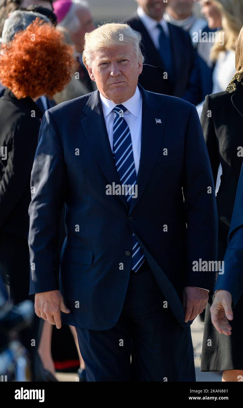 US President Donald Trump and his wife, First Lady Melania Trump, wave ...