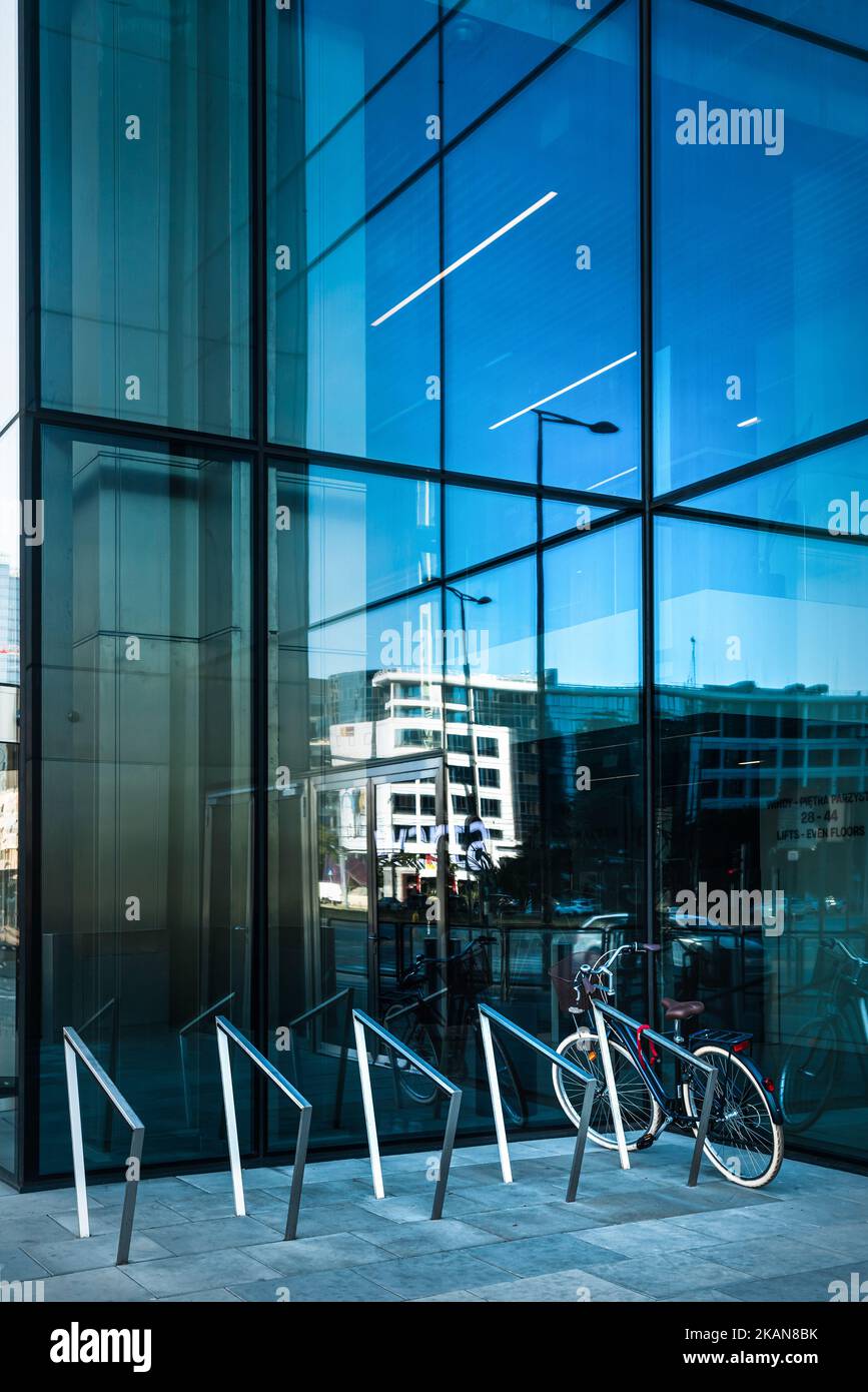 Bicycle parking and bicycle in front of office building windows Stock ...