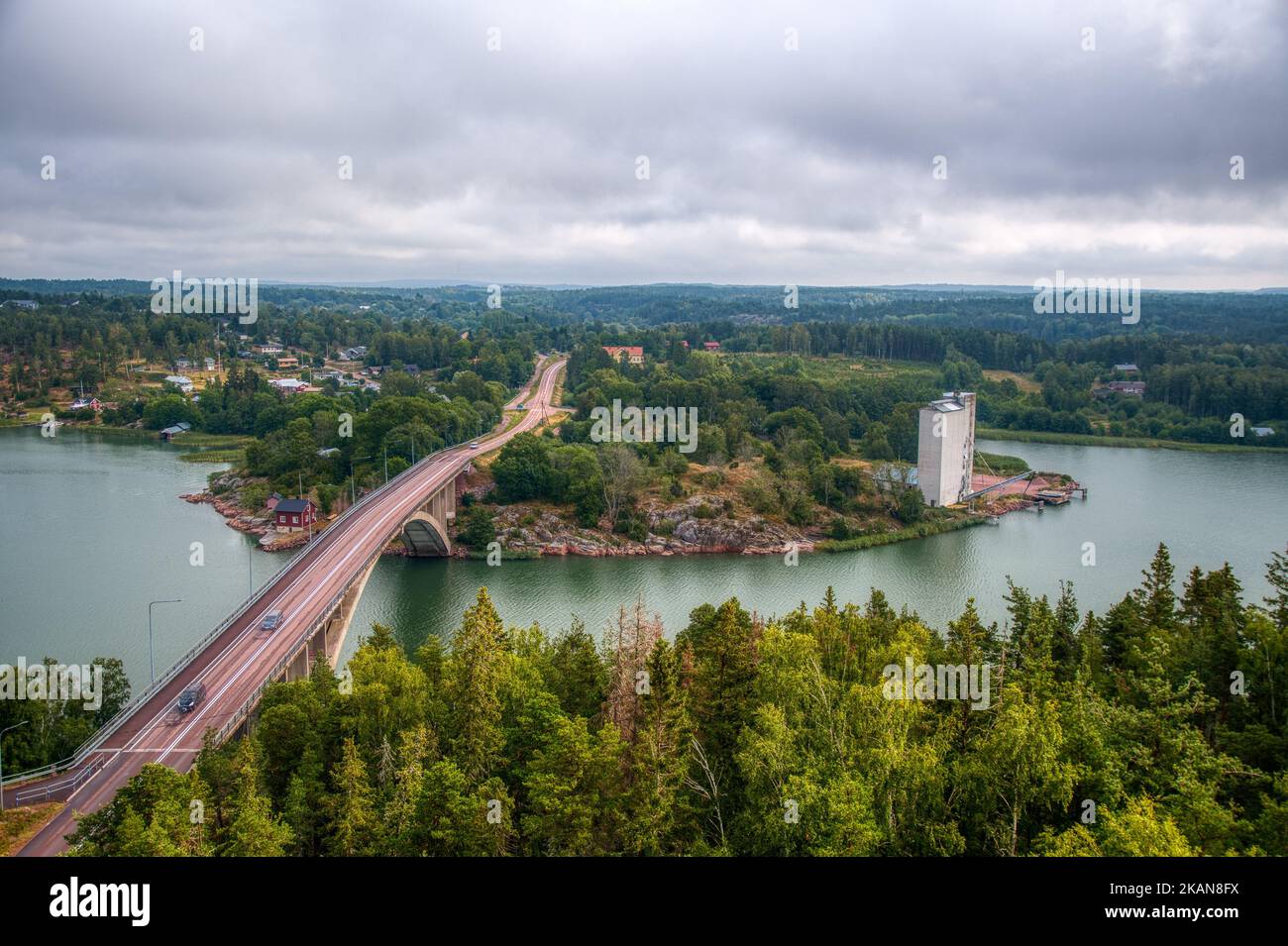 An aerial view of a bridge with cars driving on it over the Baltic Sea ...
