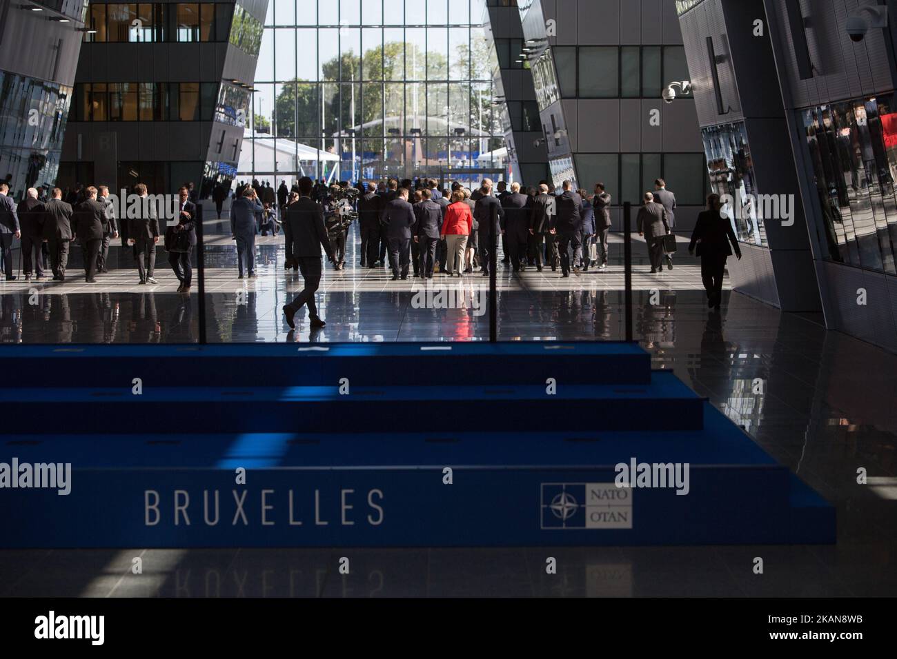 Angela Merkel, in red, walks away with other heads of State, Brussels ...