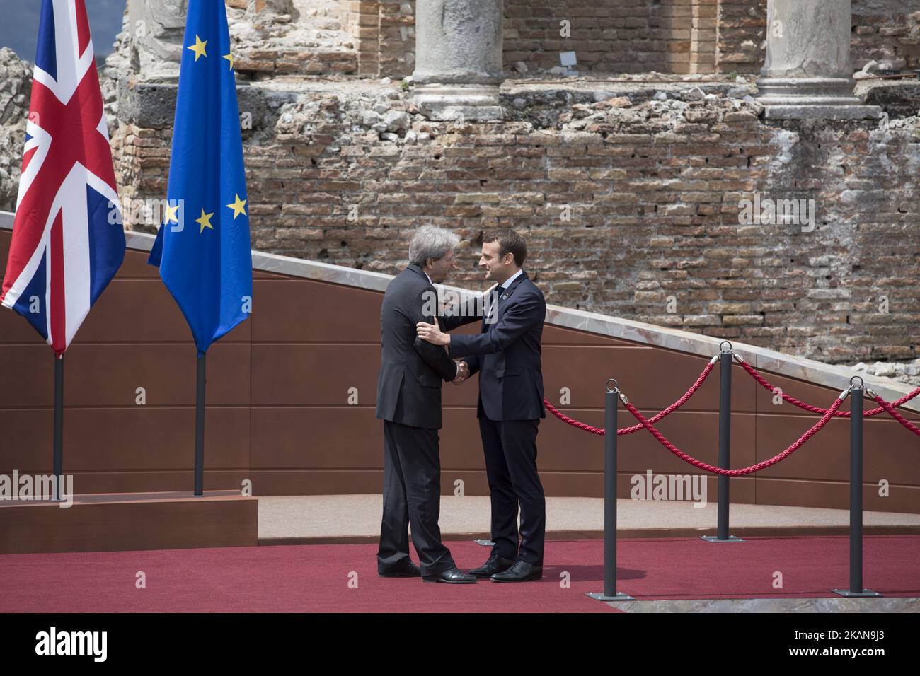 French President Emmanuel Macron shakes hands with Italia Prime ...