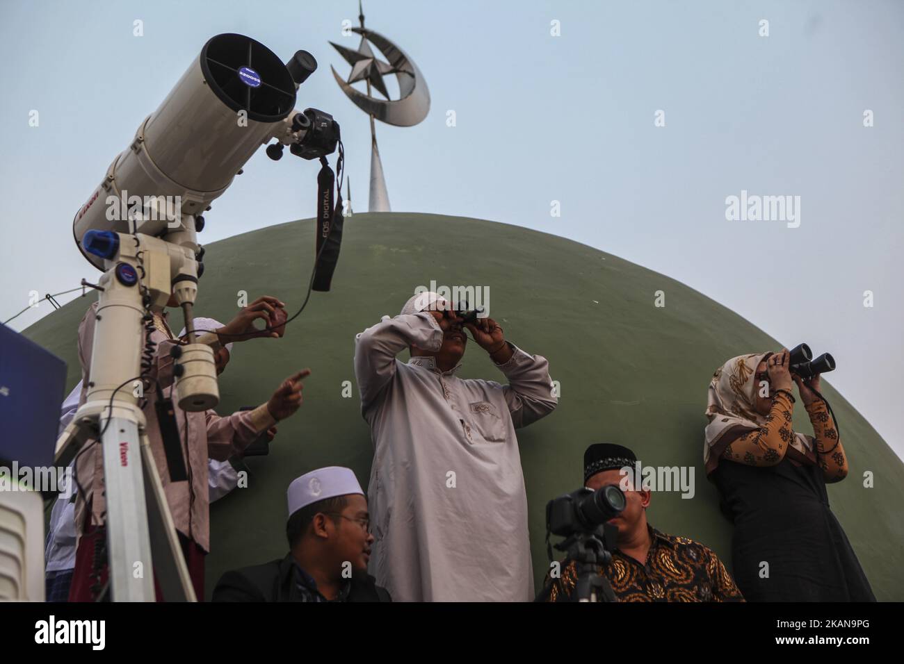 Indonesian muslim hold a Rukyatul Hilal to see the new crescent moon ...