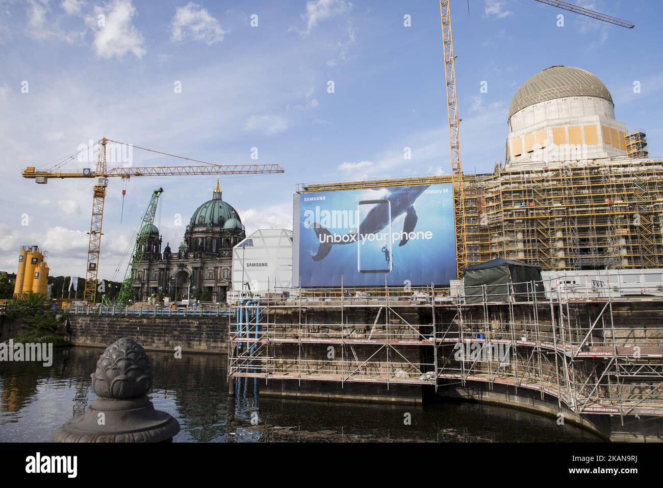 The Dome of Berlin (L) and the construction site of the Humboldt Forum ...