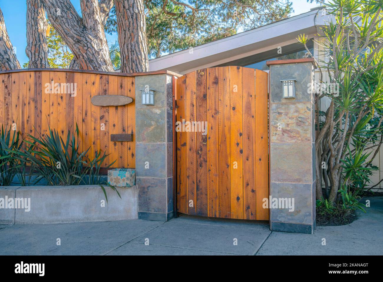 La Jolla, California- Wooden gate and wall fence of a private residence ...