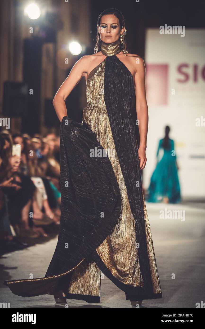 Model of Maria Jose Sarez walks on the catwalk in Seville on May 26 ...