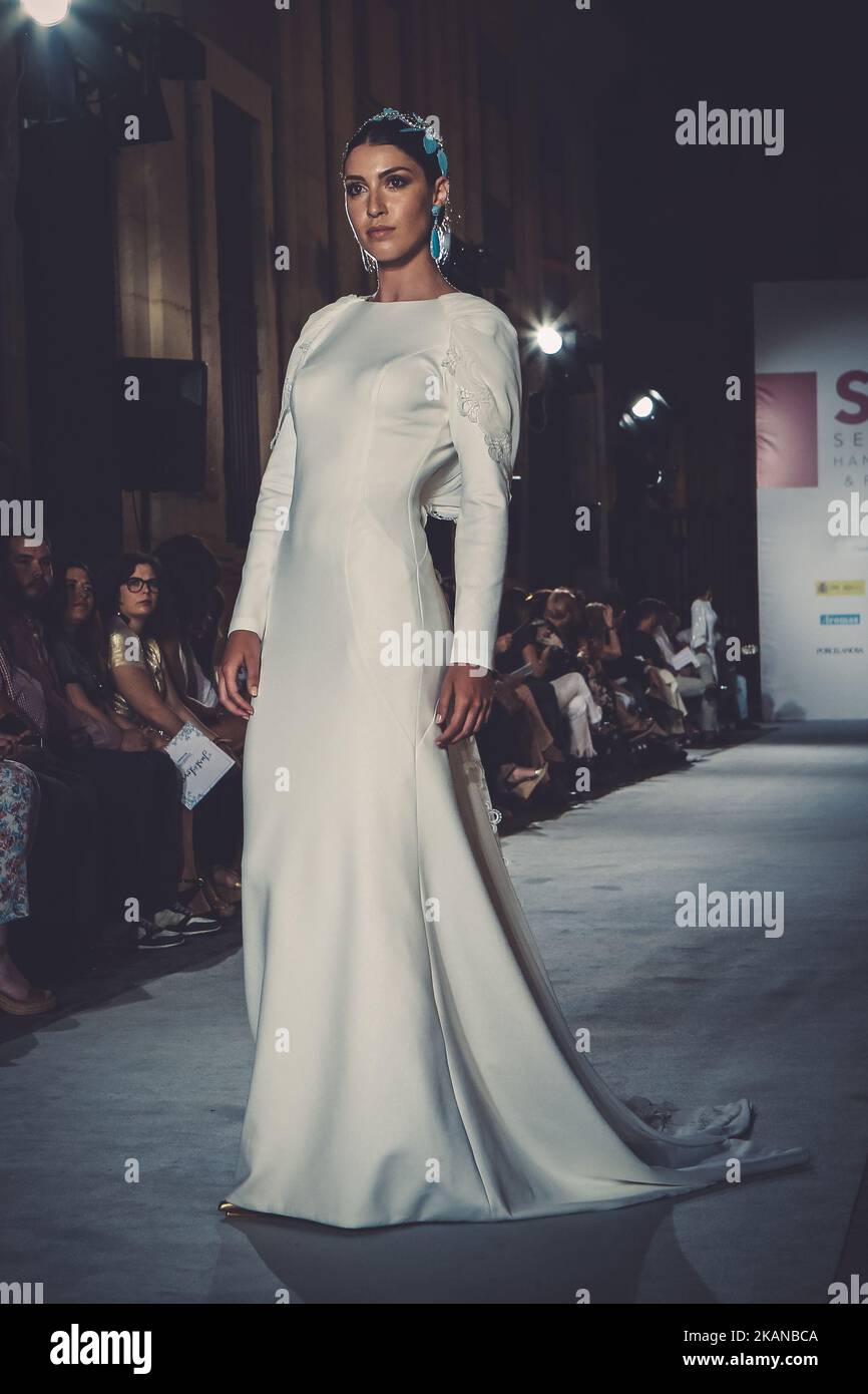Model of Maria Jose Sarez walks on the catwalk in Seville on May 26 ...