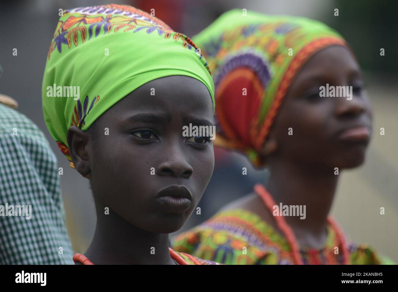 A pupil in native attire looks on during the Childrenâ€™s Day parade at ...