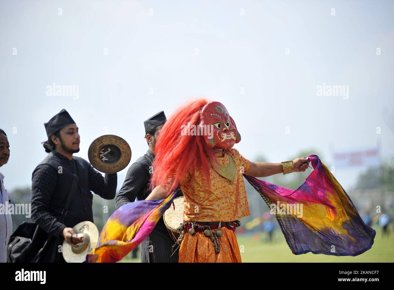 A mask dancer ‘Lakhay’ dance in a traditional instrument during the ...