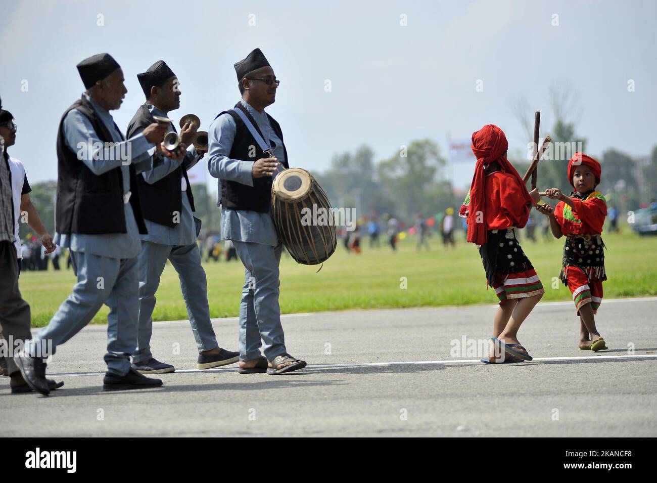 Nepalese people in a traditonal attire plays traditional instruments ...