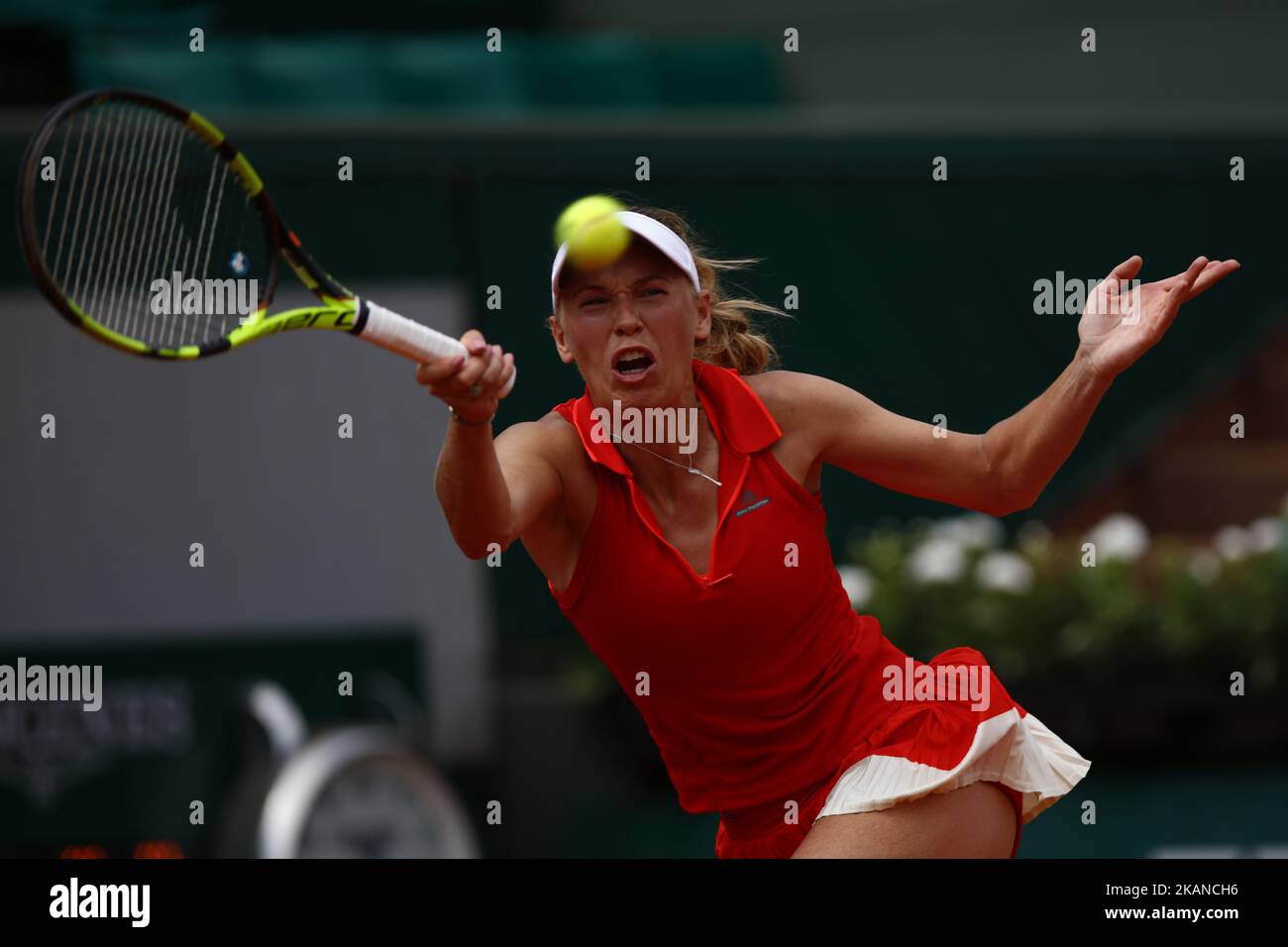 Denmark's Caroline Wozniacki returns the ball to Australia's Jaimee ...