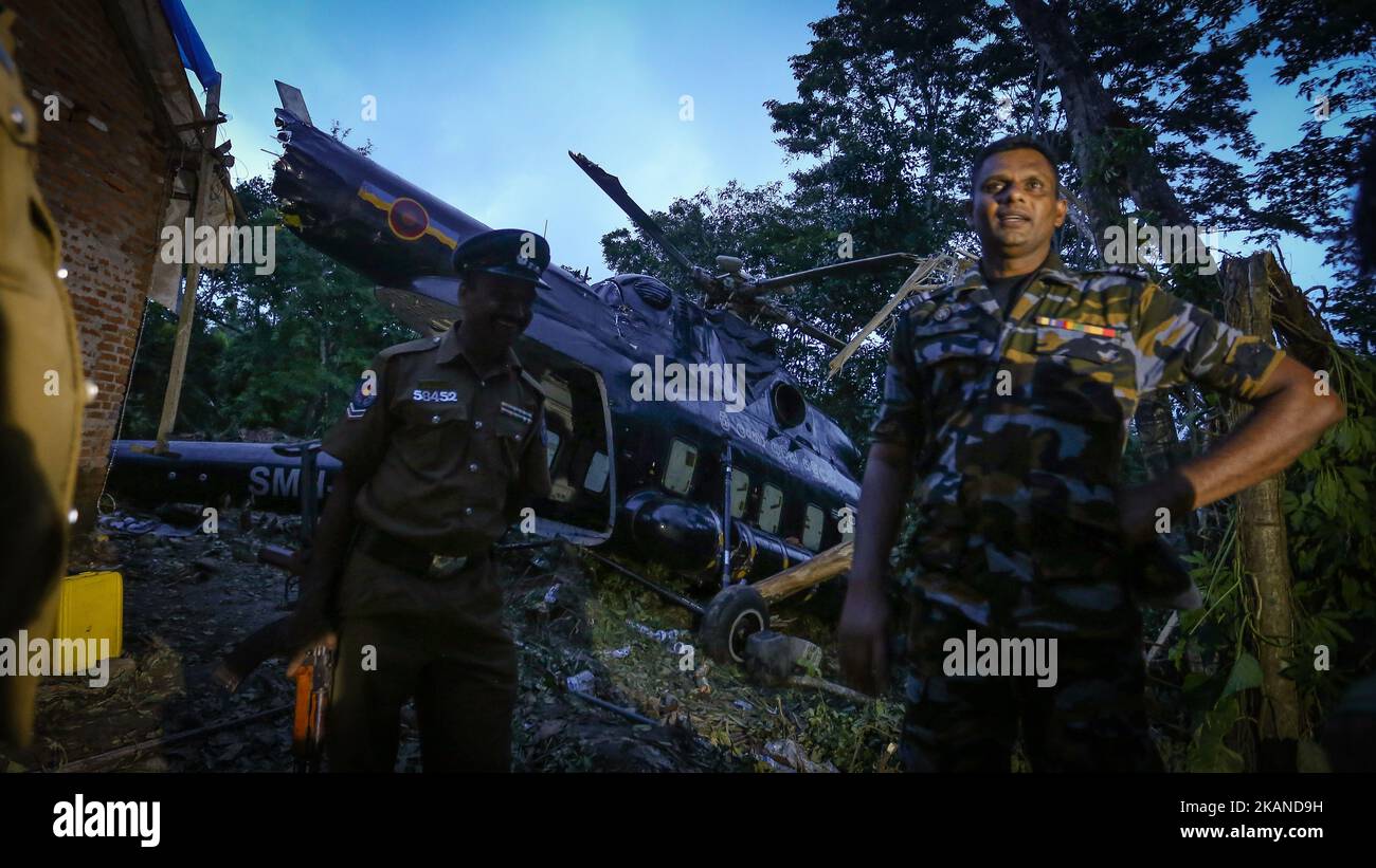 A Sri Lankan Air Force officer looks on infront of the crash-landed ...