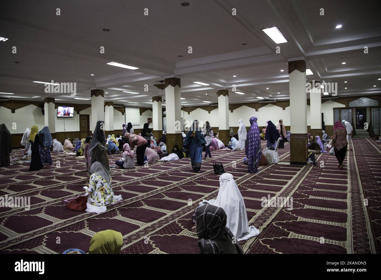 Muslims gathered at the mosque in ramadhan fasting by doing reading ...
