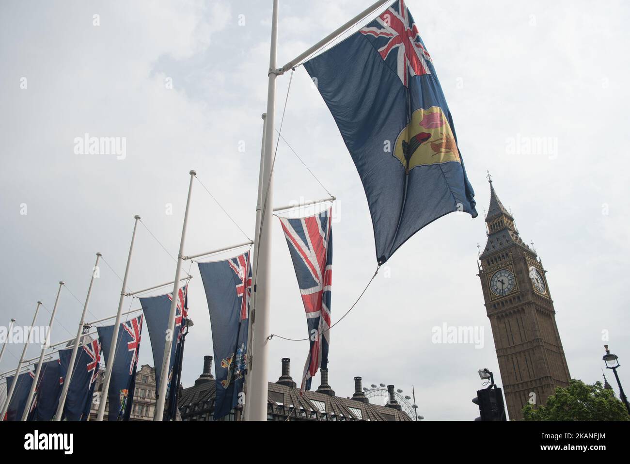 British Dominion flags are seen at Westminster, in Parliament Square ...