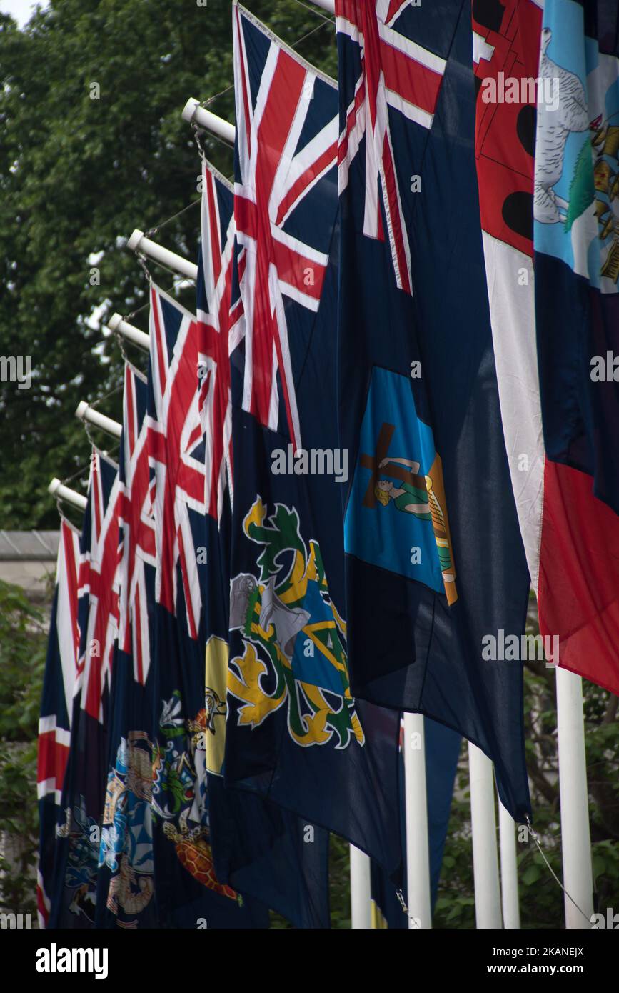 British Dominion flags are seen at Westminster, in Parliament Square ...