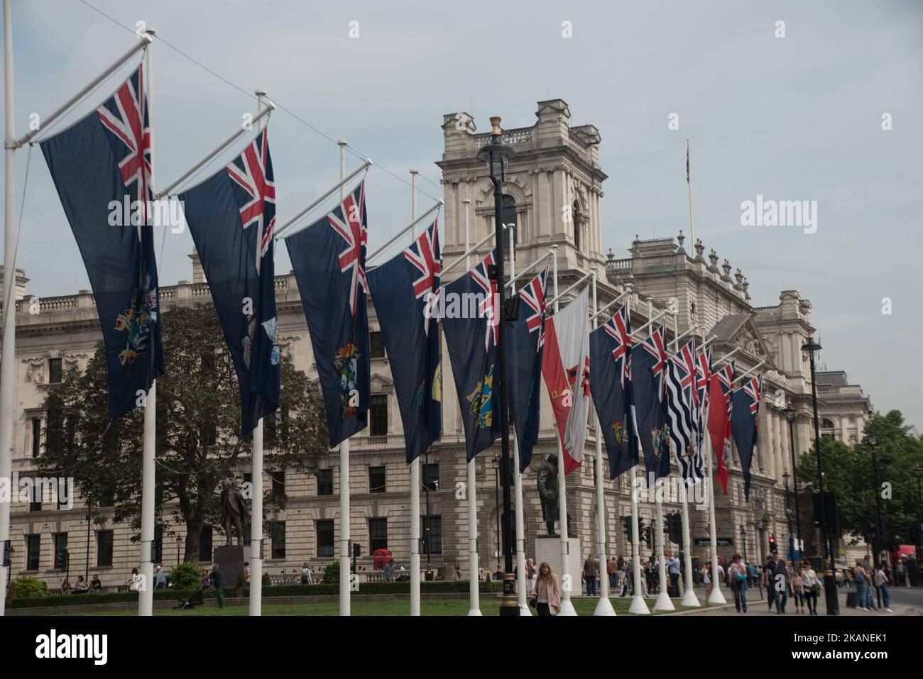 British Dominion flags are seen at Westminster, in Parliament Square ...