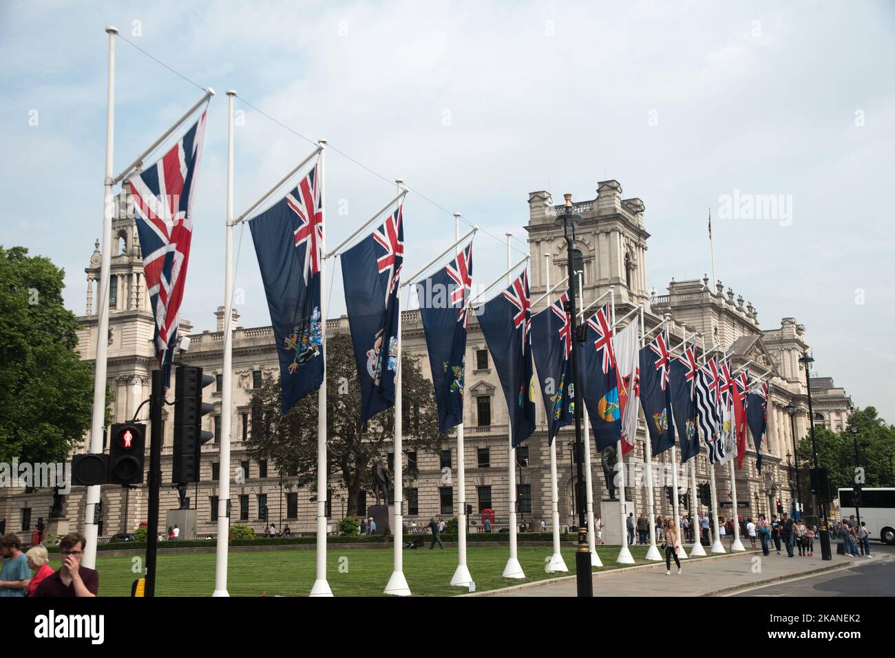 British Dominion flags are seen at Westminster, in Parliament Square ...