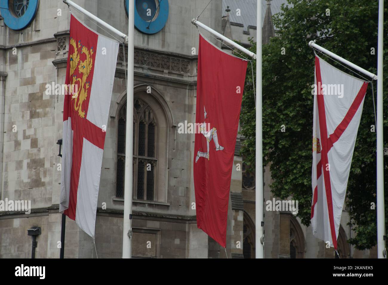 British Dominion flags are seen at Westminster, in Parliament Square ...