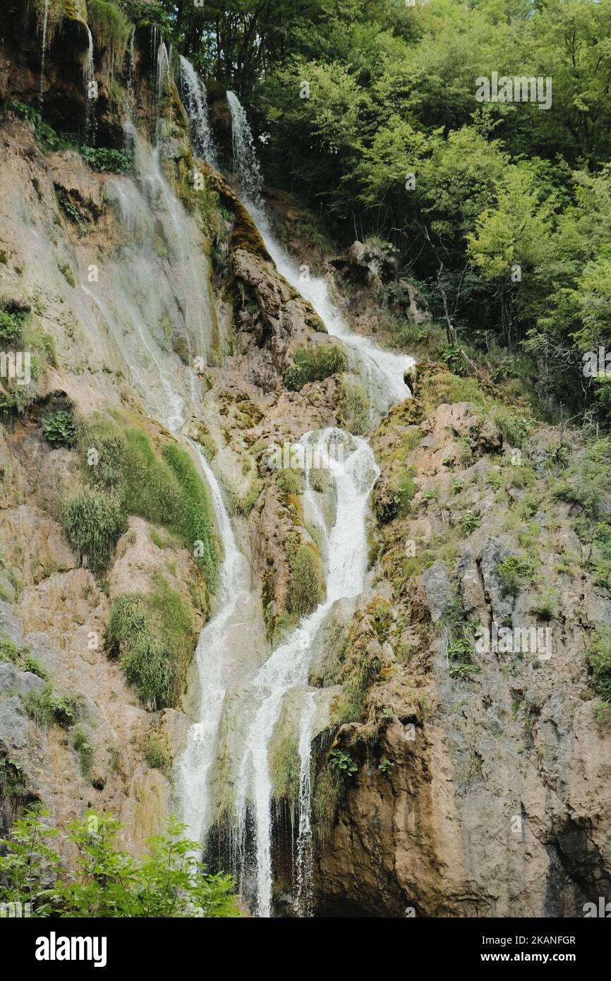A waterfall cascading on rocks at Plitvice Lakes National Park, Croatia ...