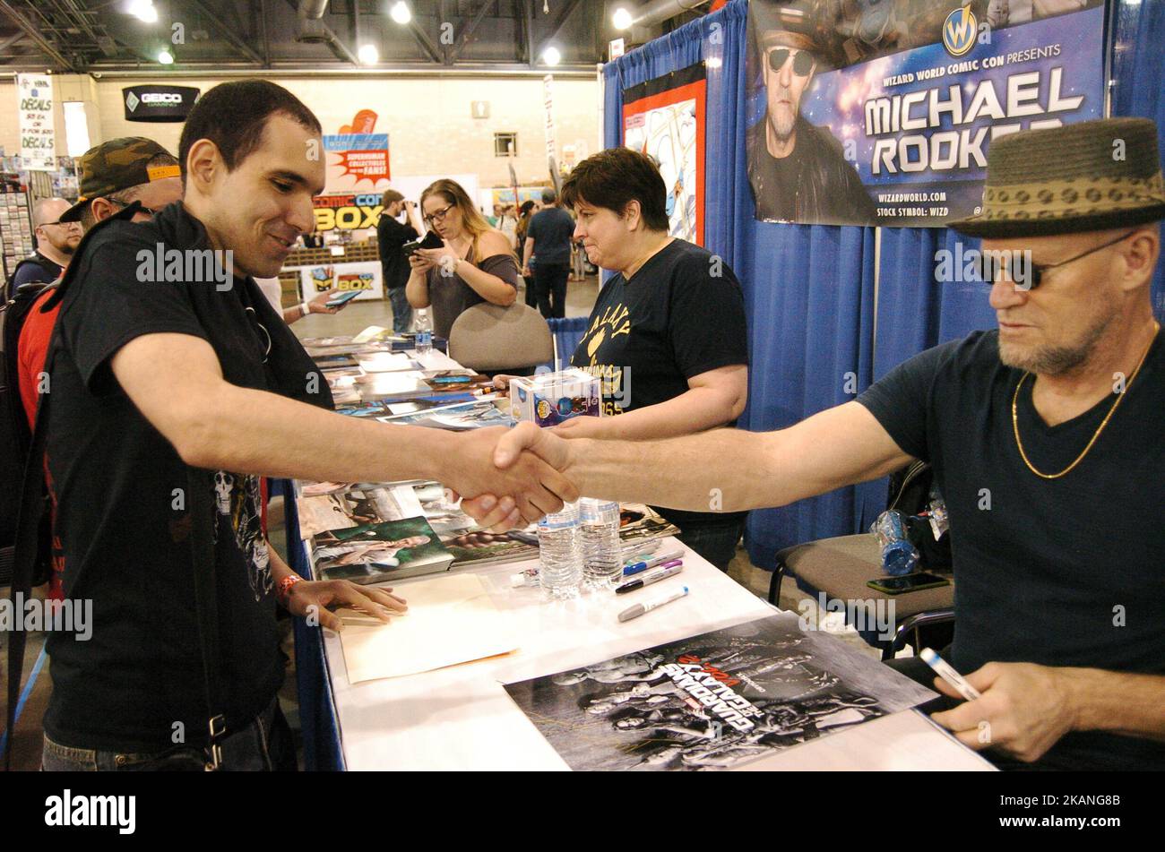 Micheal Rooker shakes the hand of a long time fan o the Walking Dead ...