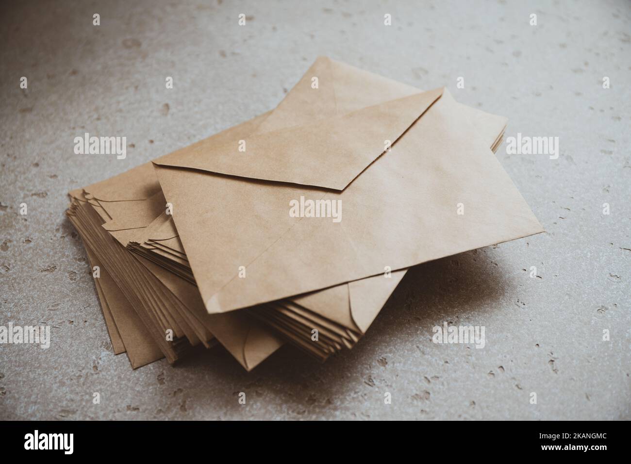 A stack of craft paper envelopes on a table Stock Photo - Alamy