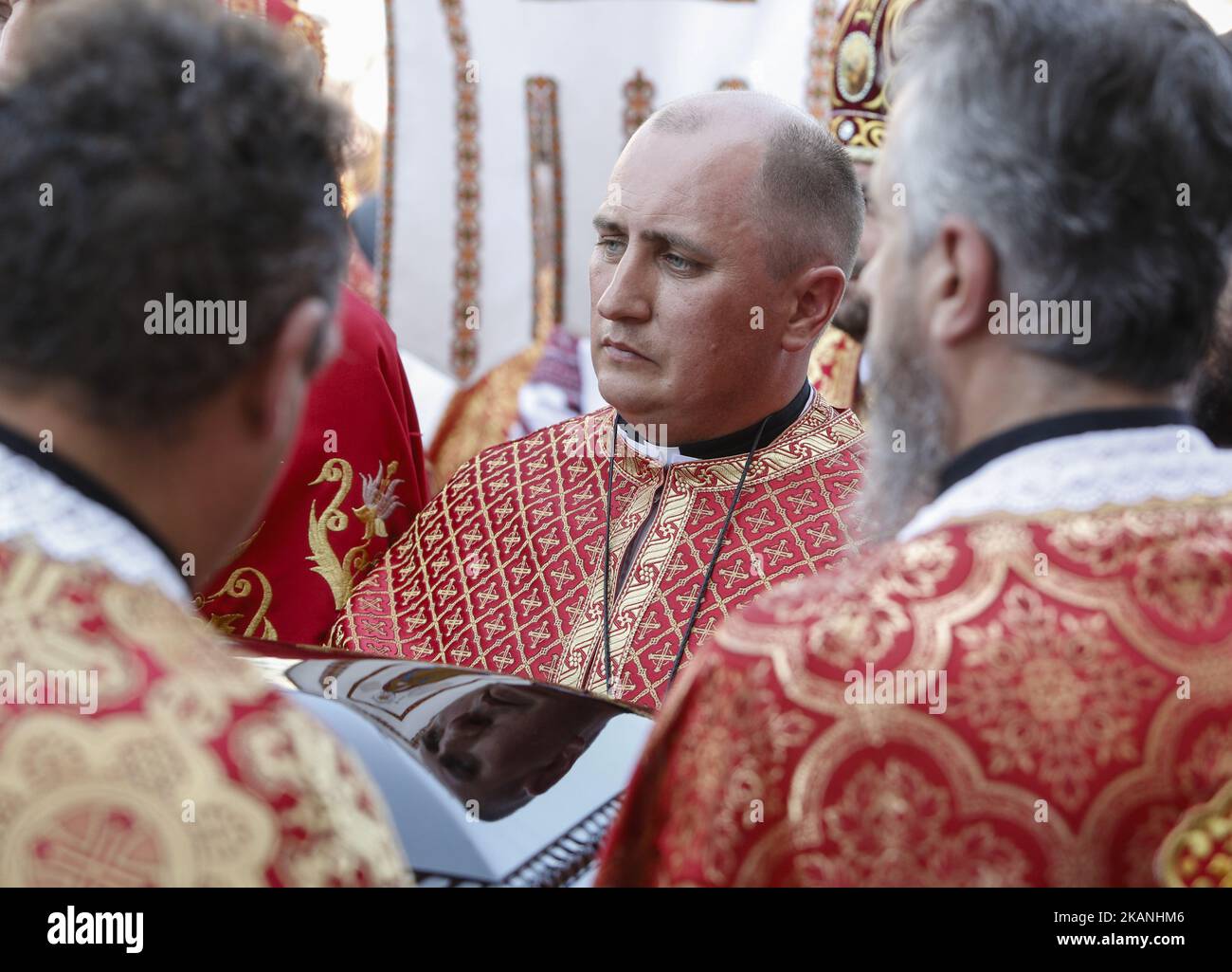Priests carry the coffin with the body of Cardinal Husar out of the ...
