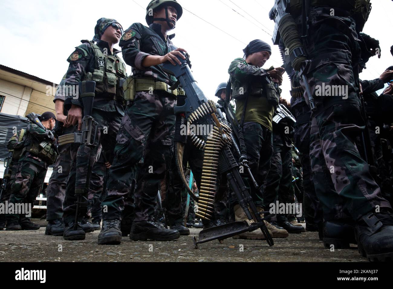 Striking force of the Philippine National Police or RPSB listens to ...
