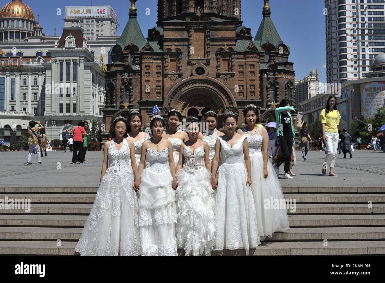 Chinese college graduates wearing wedding dress at St. Sophia Cathedral ...