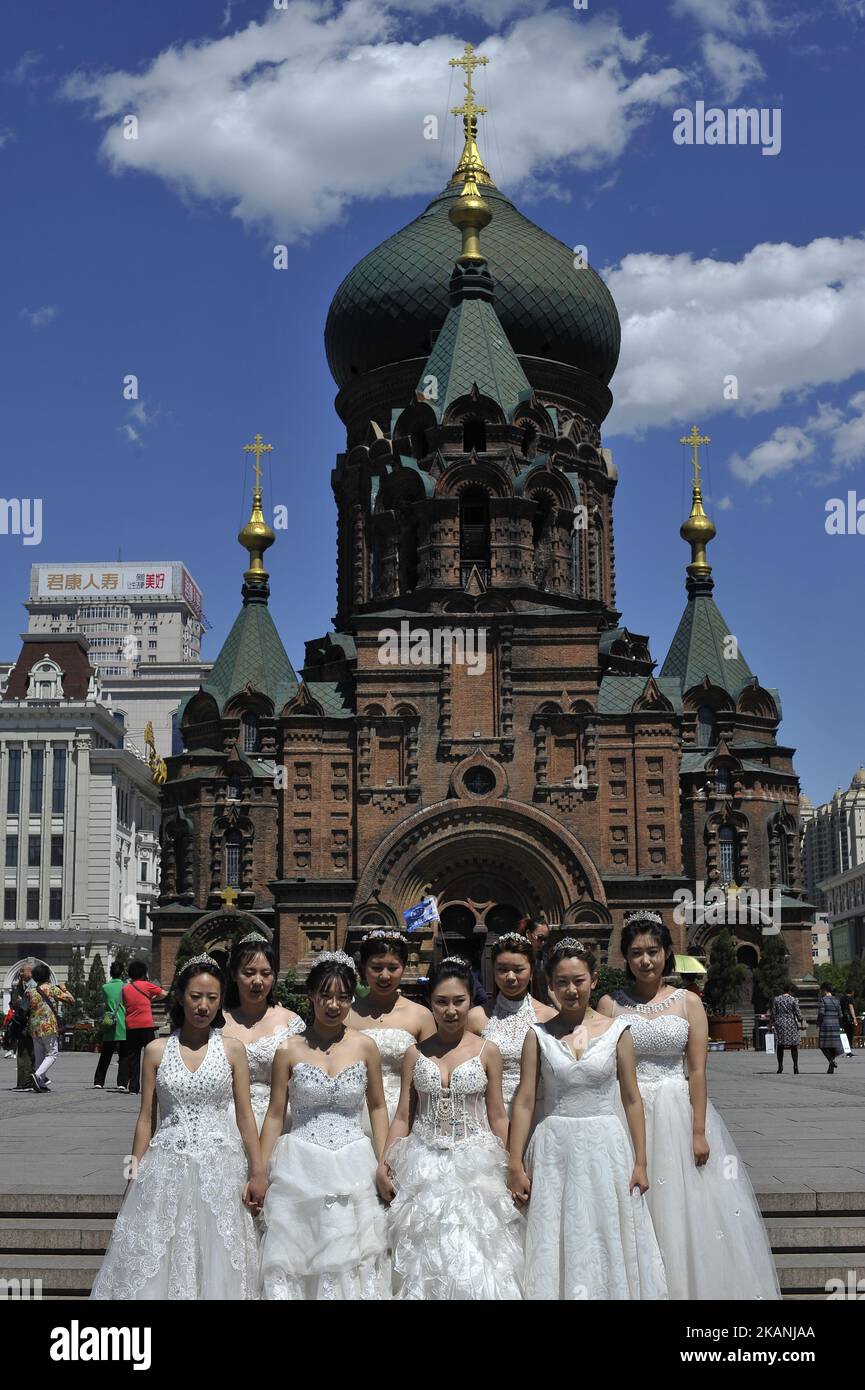 Chinese college graduates wearing wedding dress at St. Sophia Cathedral ...
