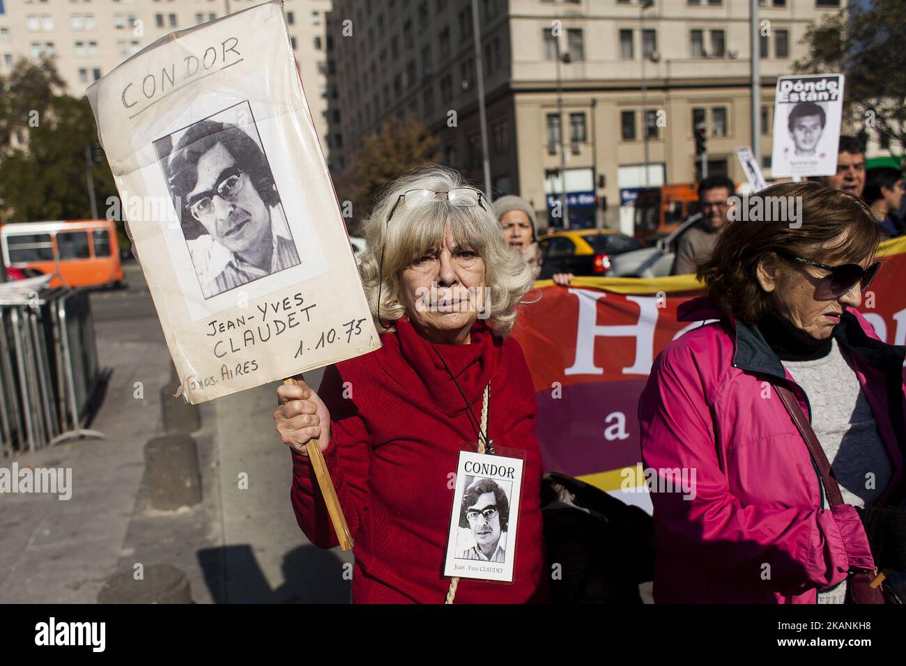 Santiago, Chile. 9 June 2017. Protesters carry posters with photographs ...