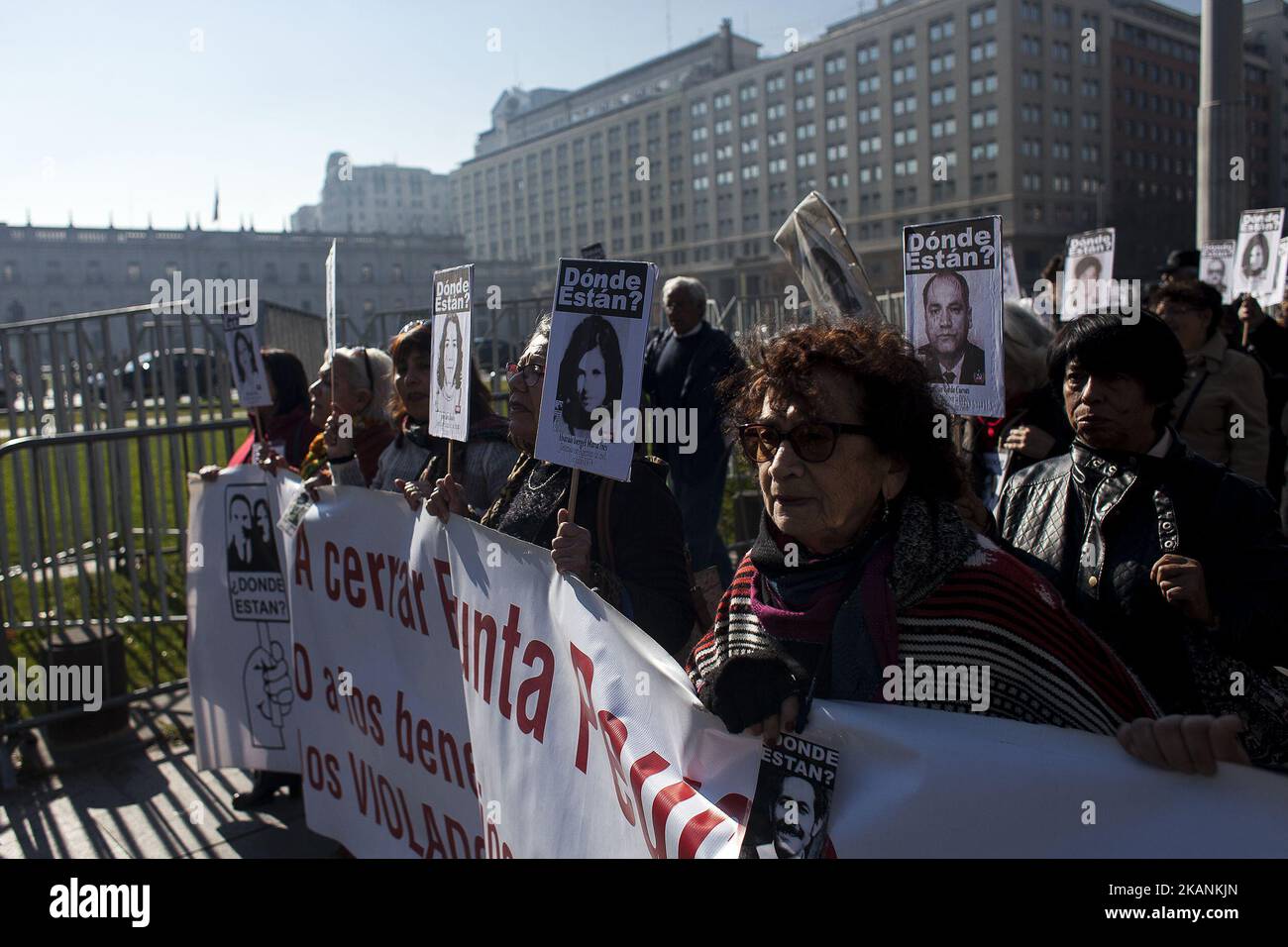 Santiago, Chile. 9 June 2017. Protesters carry posters with photographs ...