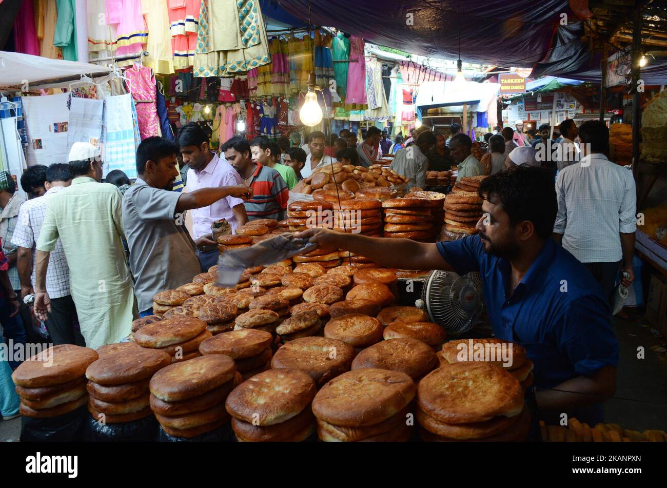 Indian Muslim people buying sweet bread for Eid ul Fitr festival in ...