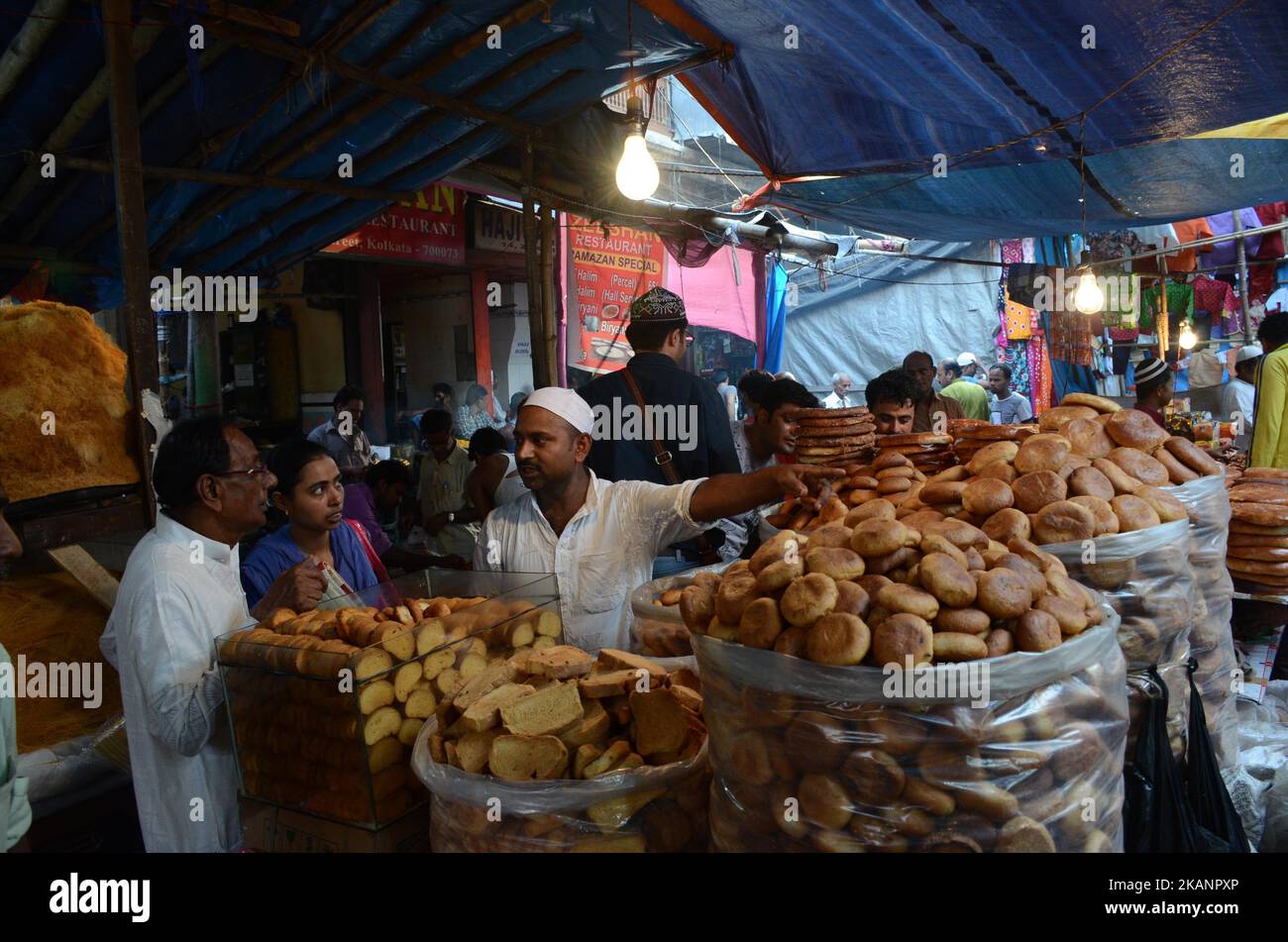 Indian Muslim people buying sweet bread for Eid ul Fitr festival in ...