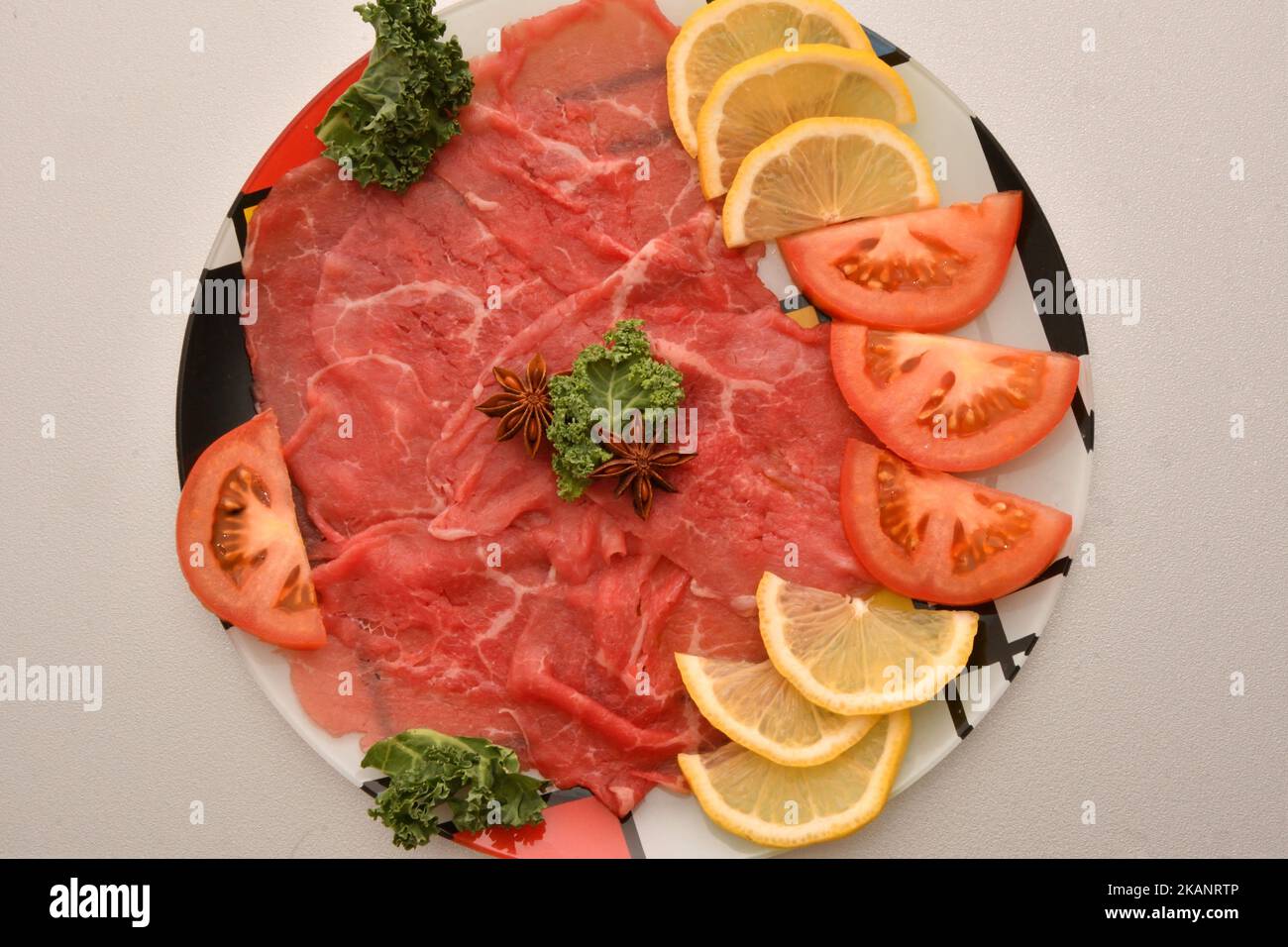 Beef carpaccio and fresh herbs for the Christmas table Stock Photo - Alamy
