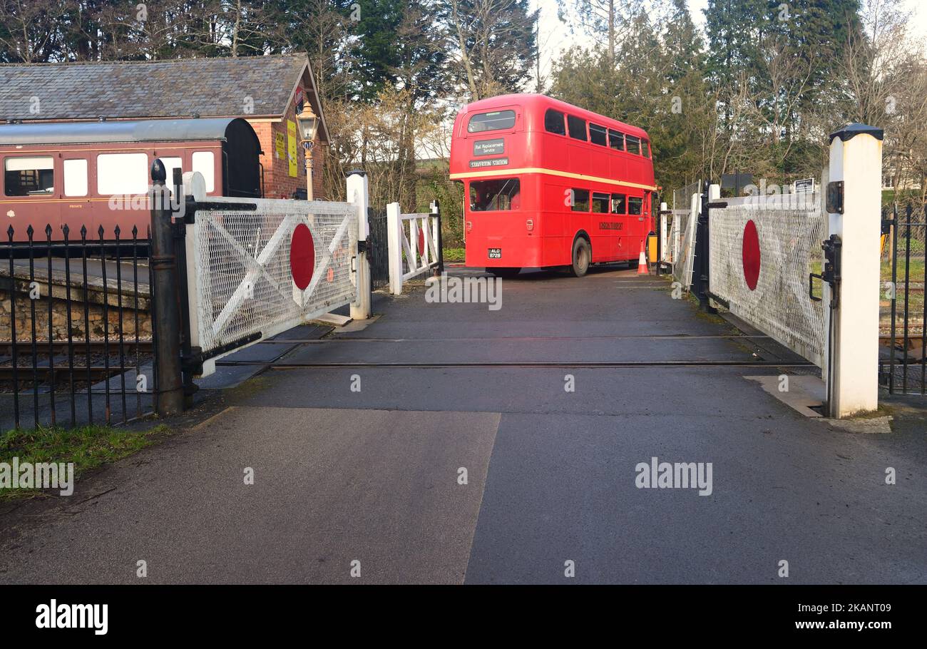 Vintage Routemaster double-decker bus on the level crossing at the ...