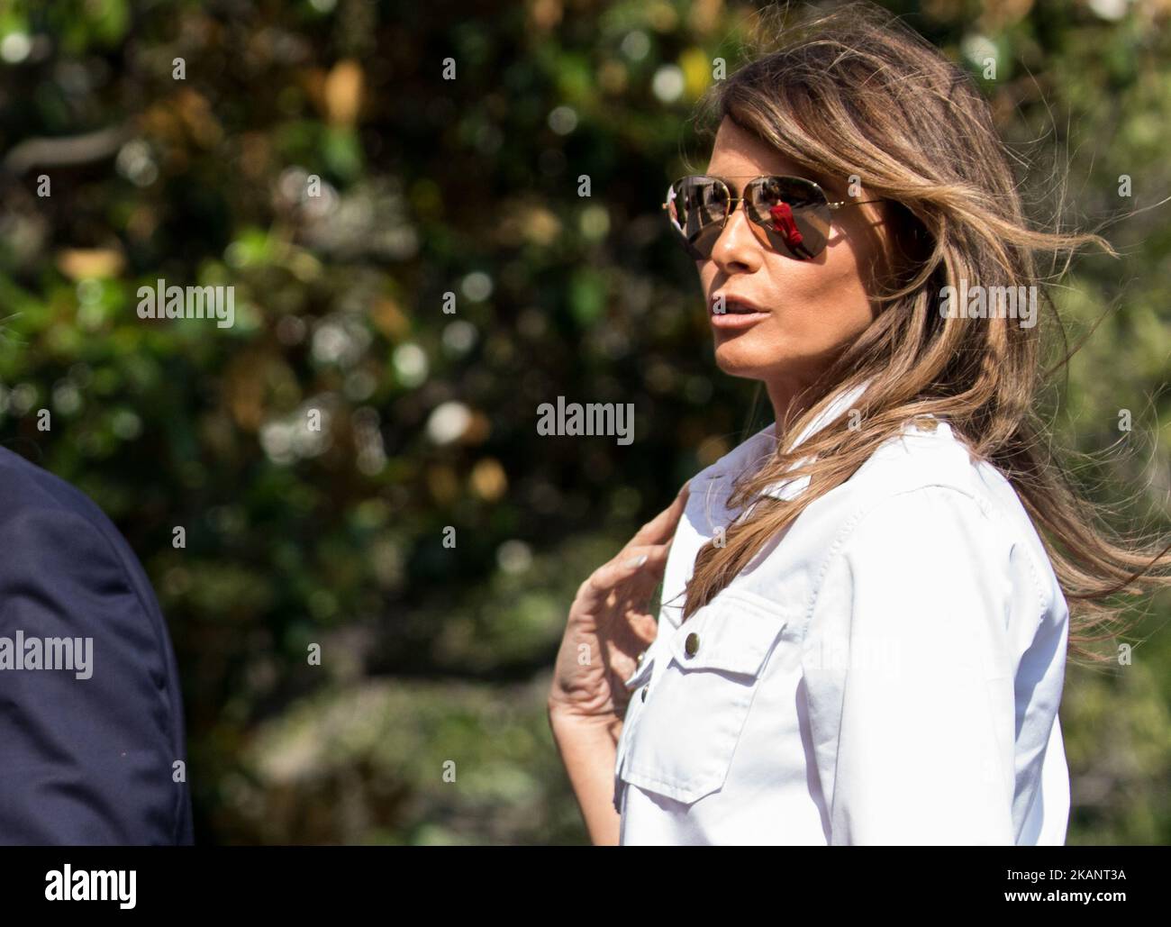 First Lady Melanie Trump, with the refletion of her 11-year-old son ...