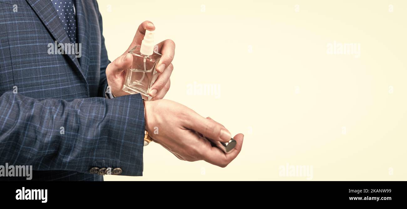 Professional man cropped view apply perfume liquid on wrist, masculine ...