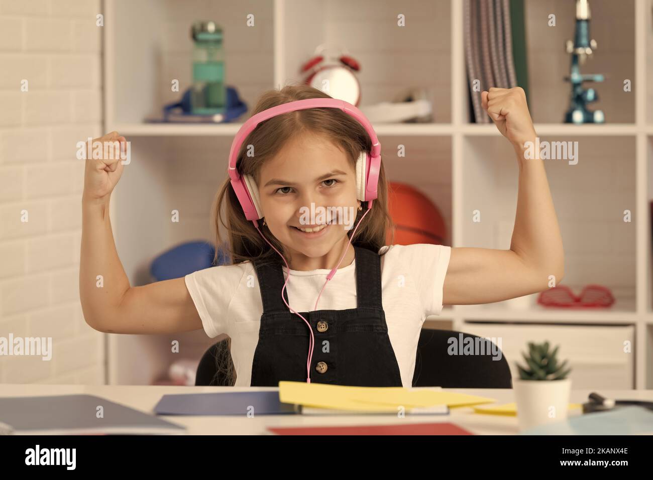happy girl listen to music in headphones at school classroom Stock ...