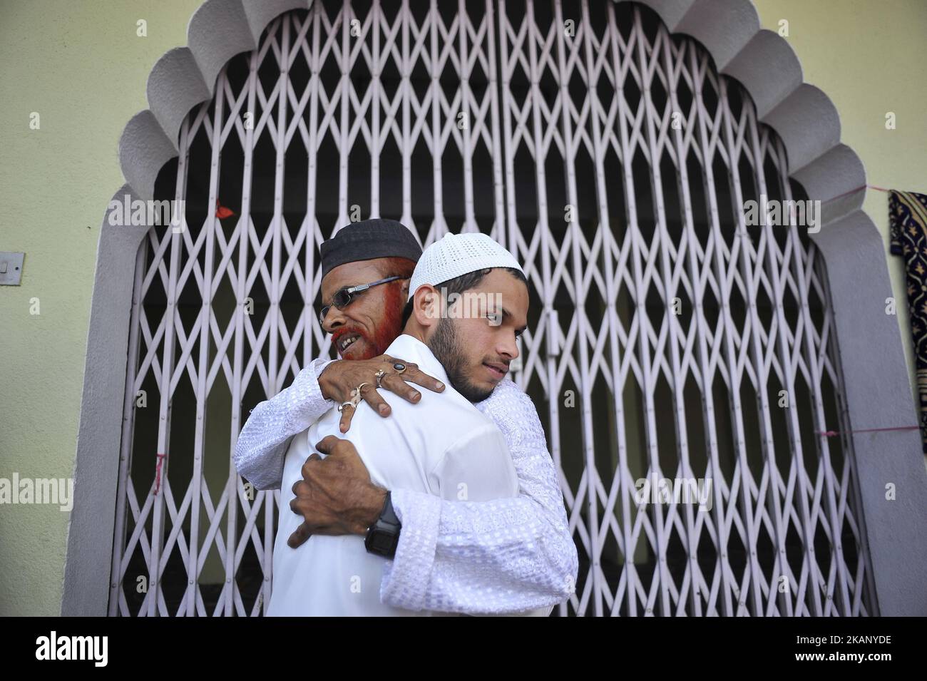 Nepalese Muslims hug each other after offering ritual morning prayers ...