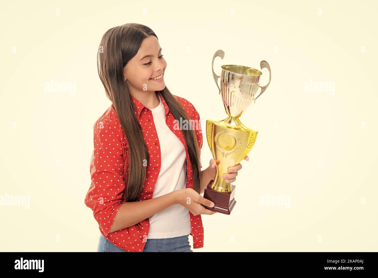 Teenage girl holding a trophy. Kid winner child won the competition ...